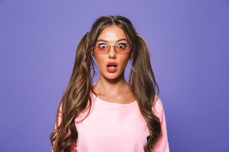 Premium Photo Portrait Of A Shocked Woman In Sweatshirt In Sunglasses