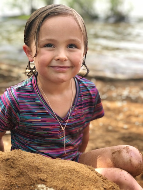 Premium Photo Portrait Of Smiling Cute Girl At Beach