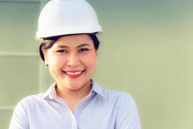 Premium Photo | Portrait of smiling female architect wearing hardhat Premium Photo | Portrait of smiling female architect wearing hardhat