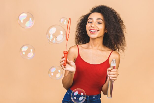 Premium Photo Portrait Woman Blowing Soap Bubbles