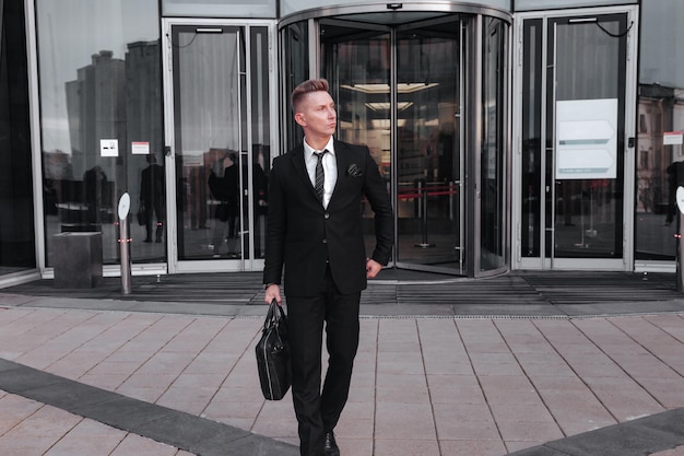 Premium Photo | Portrait young man businessman with briefcase ... Premium Photo | Portrait young man businessman with briefcase ...