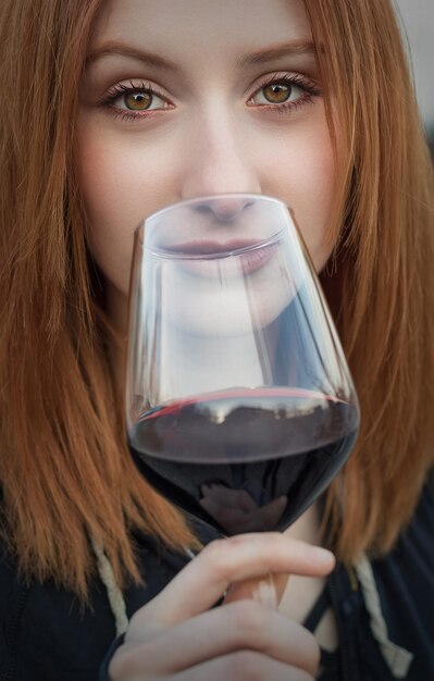 Premium Photo Portrait Of Young Woman Holding Red Wine In Glass