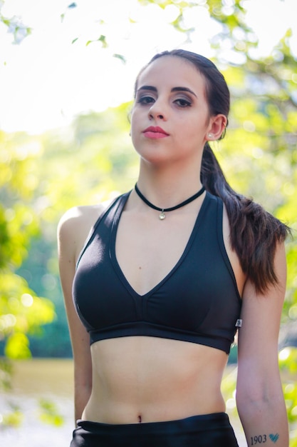 Premium Photo Portrait Of Young Woman Wearing Sports Bra At Park