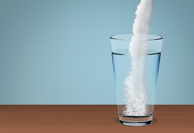 Premium Photo | Powder being poured into glass with water Premium Photo | Powder being poured into glass with water