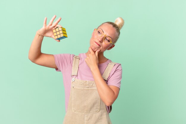 Premium Photo | Pretty blond woman solving an intelligence problem Premium Photo | Pretty blond woman solving an intelligence problem