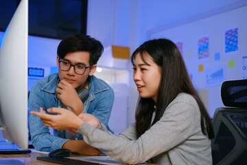 Premium Photo | Programmer and developer teamwork working in a software development and coding ...