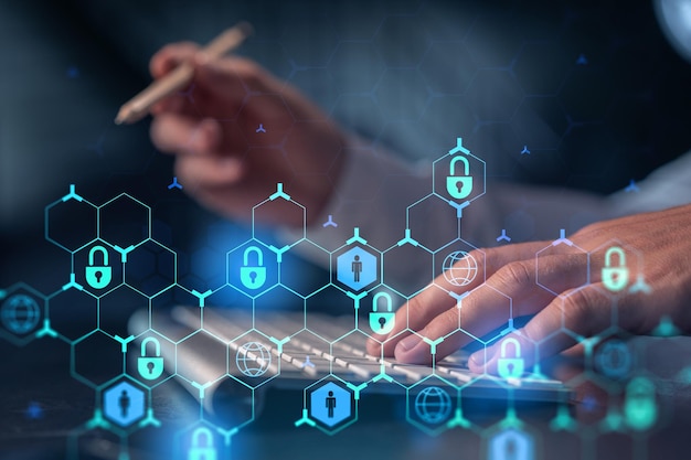 Premium Photo | A programmer is typing a code on computer to protect a ...