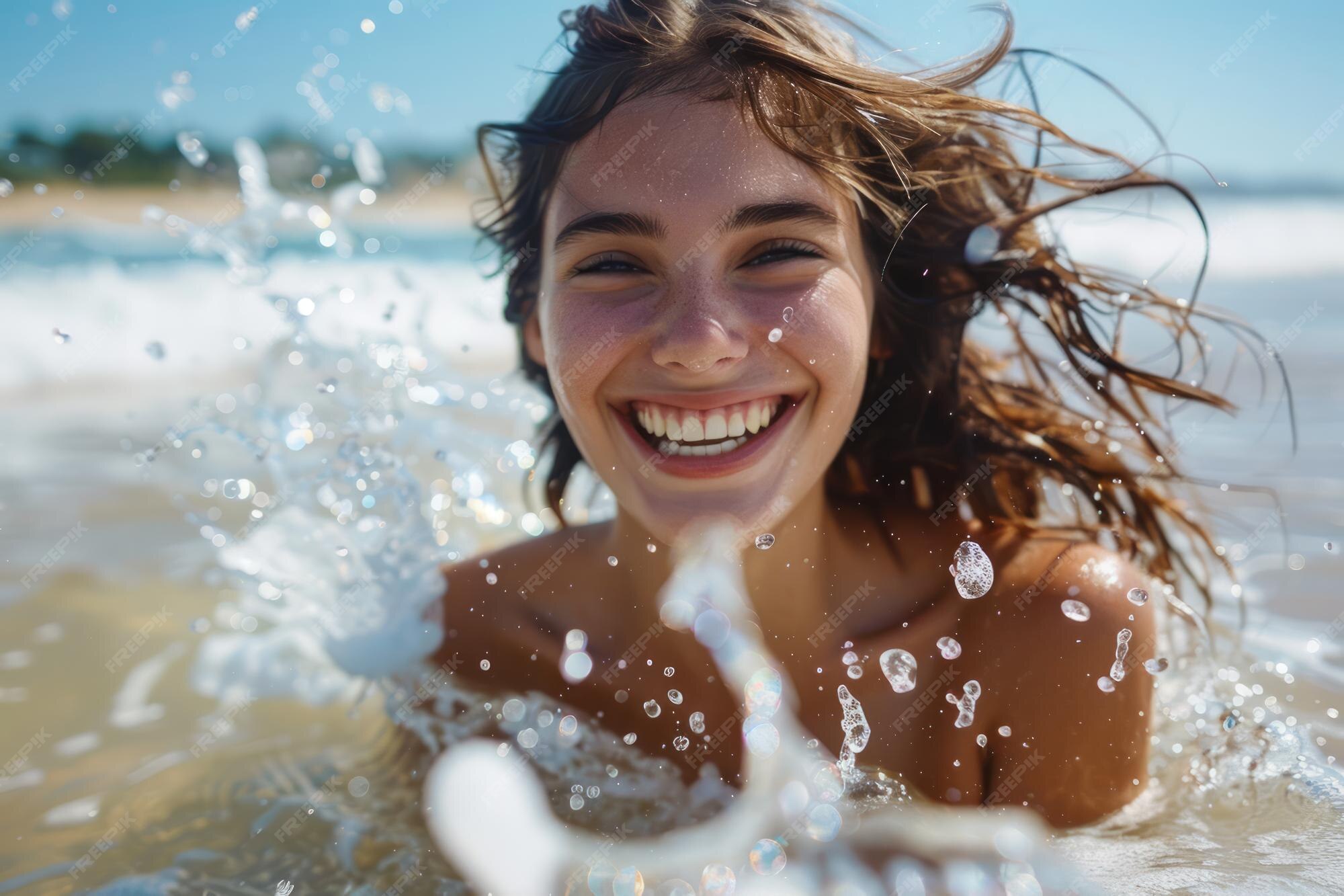 Premium Photo Radiant Young Woman Enjoying Summer Splash In Ocean Waves With Sunlit Water