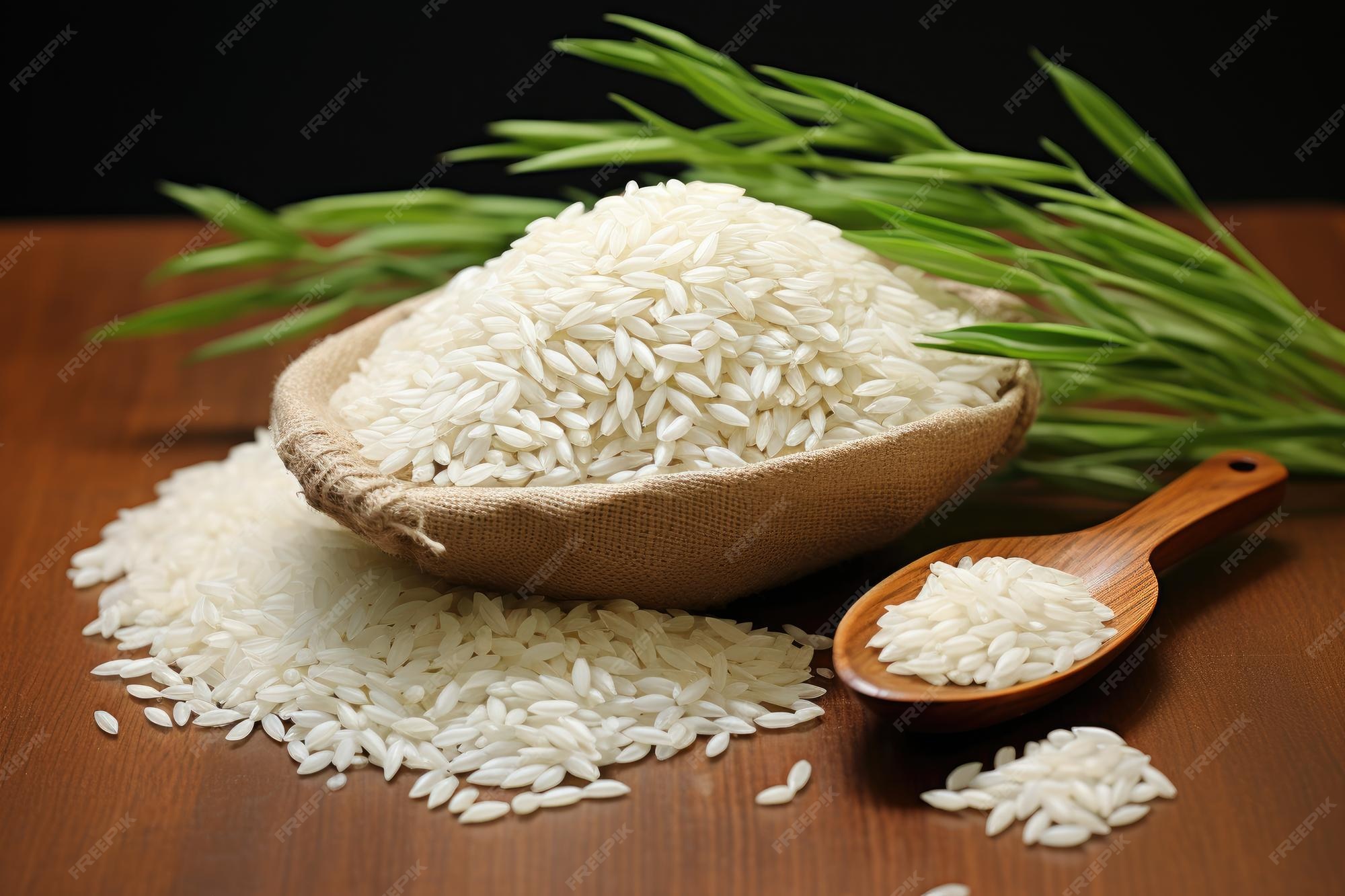 Premium Photo Raw Rice Grain And Dry Rice Plant On Wooden Table