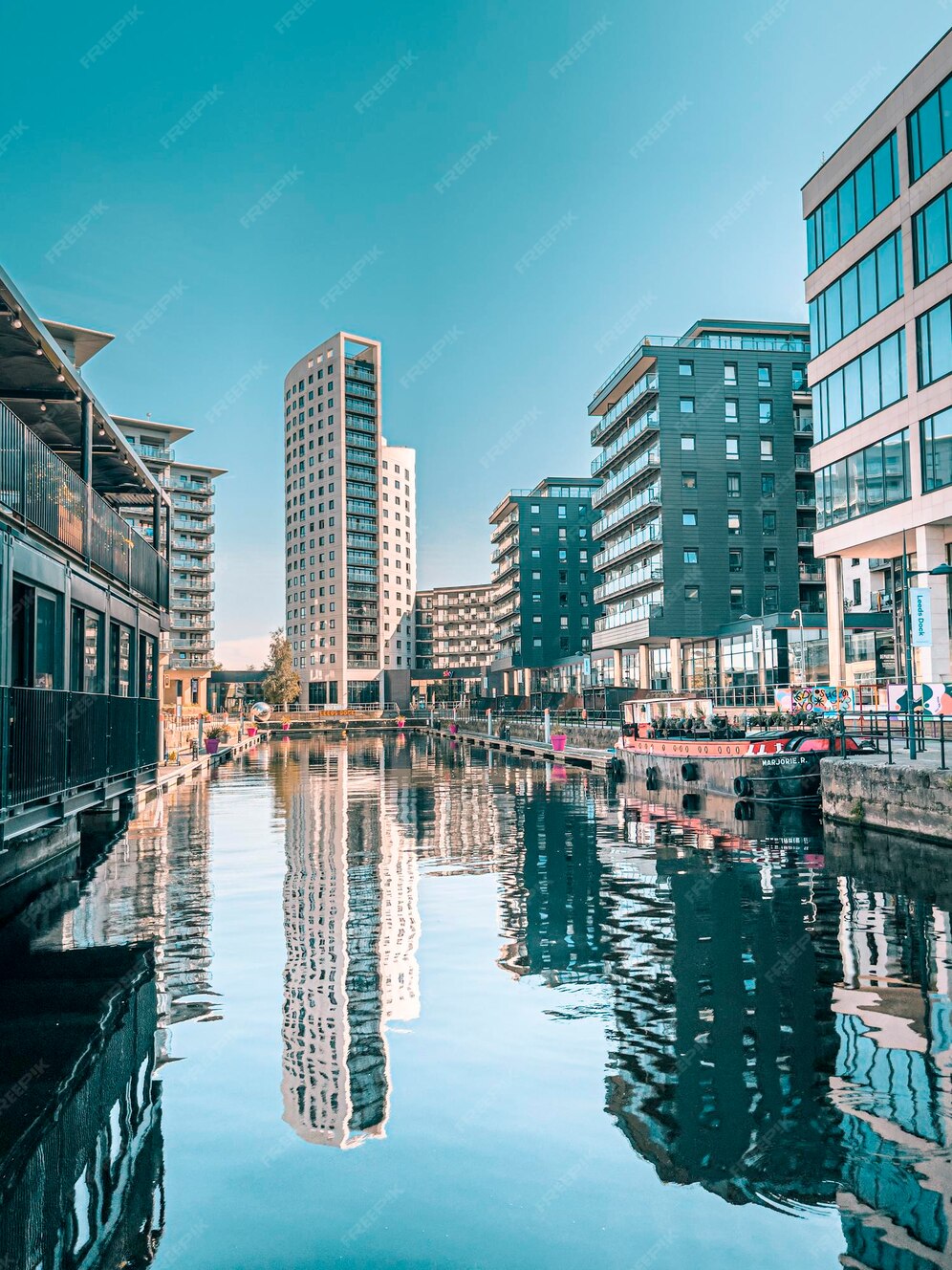 Premium Photo | Reflection of buildings in the canal at leeds docks Premium Photo | Reflection of buildings in the canal at leeds docks