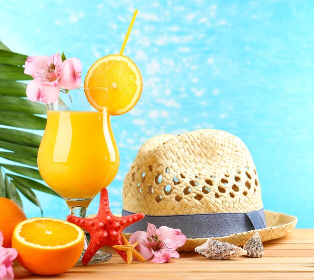 Premium Photo Refreshing Orange Cocktail On Beach Table