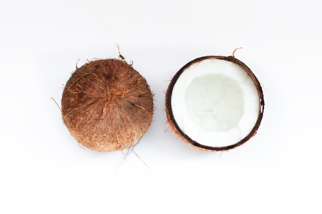Premium Photo | Ripe coconuts and half coconut on white background Premium Photo | Ripe coconuts and half coconut on white background