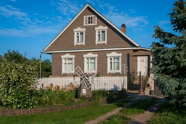 Premium Photo Russian Traditional Wooden House And A Front Garden On
