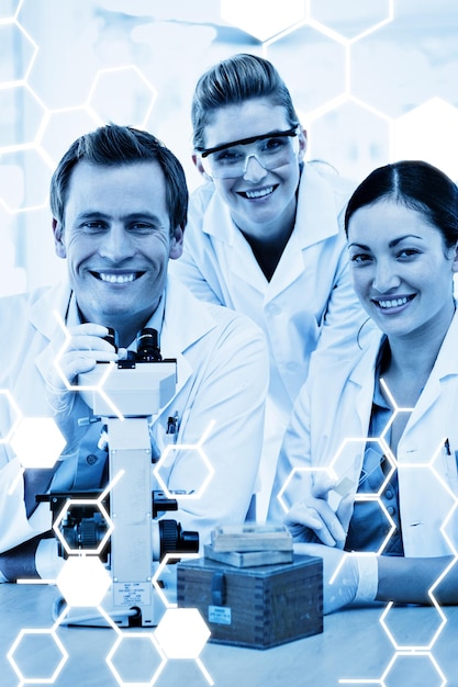 Premium Photo | Science graphic against young scientists working with a ... Premium Photo | Science graphic against young scientists working with a ...