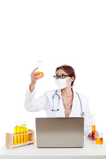 Premium Photo | Scientist looking at test tube Premium Photo | Scientist looking at test tube