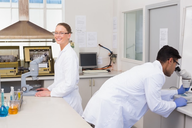 Premium Photo | Scientists using microscope Premium Photo | Scientists using microscope