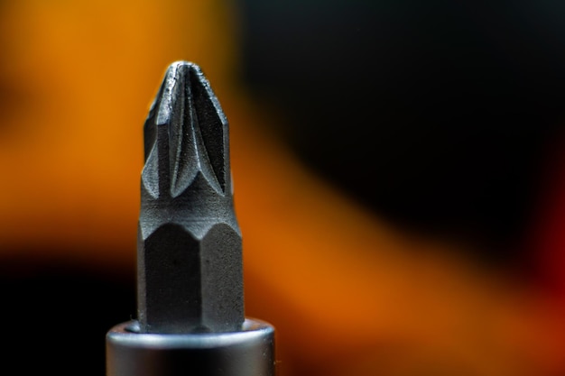 Premium Photo | Screwdriver bit macro closeup on blurred background Premium Photo | Screwdriver bit macro closeup on blurred background