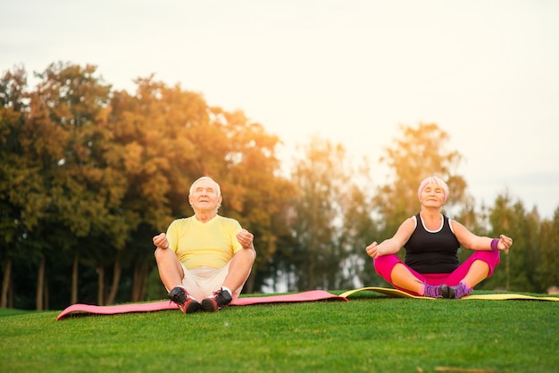 Premium Photo | Senior couple doing yoga Premium Photo | Senior couple doing yoga
