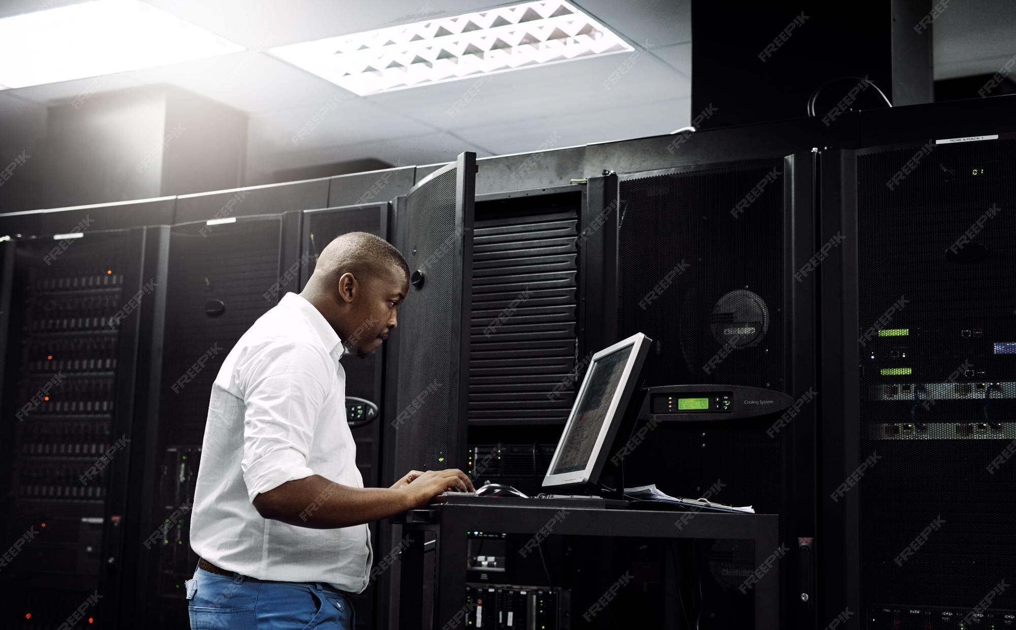 Premium Photo | Server room black man or coding on computer for programming or digital error in ...