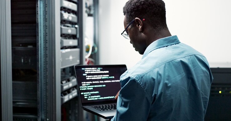 Premium Photo | Server room black man or coding with laptop for system ...