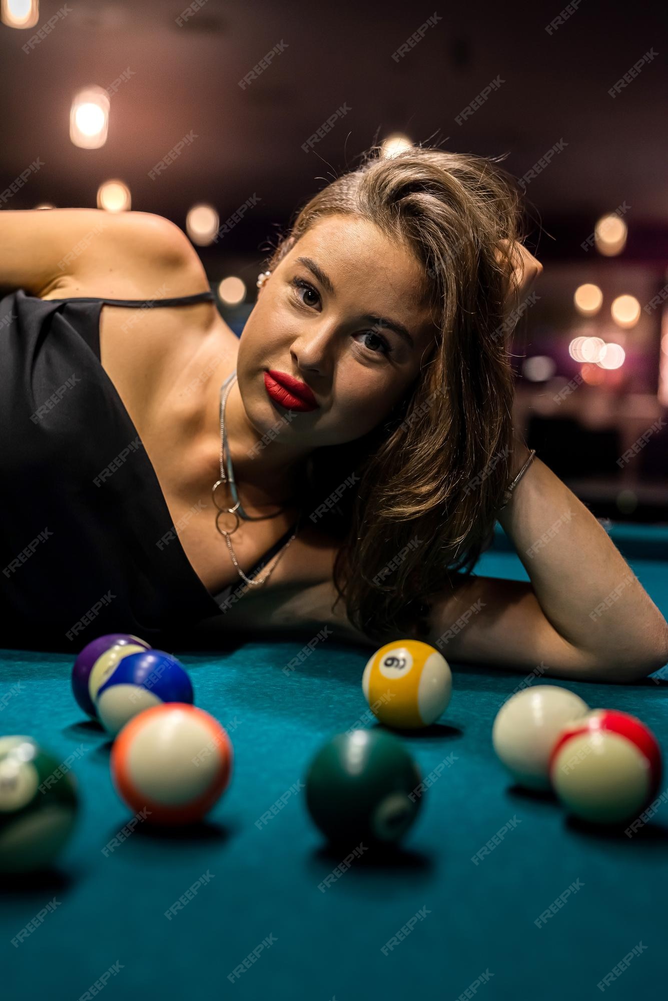 Premium Photo Sexy Female Pool Player Wear Black Dress Lying On Billiard Table
