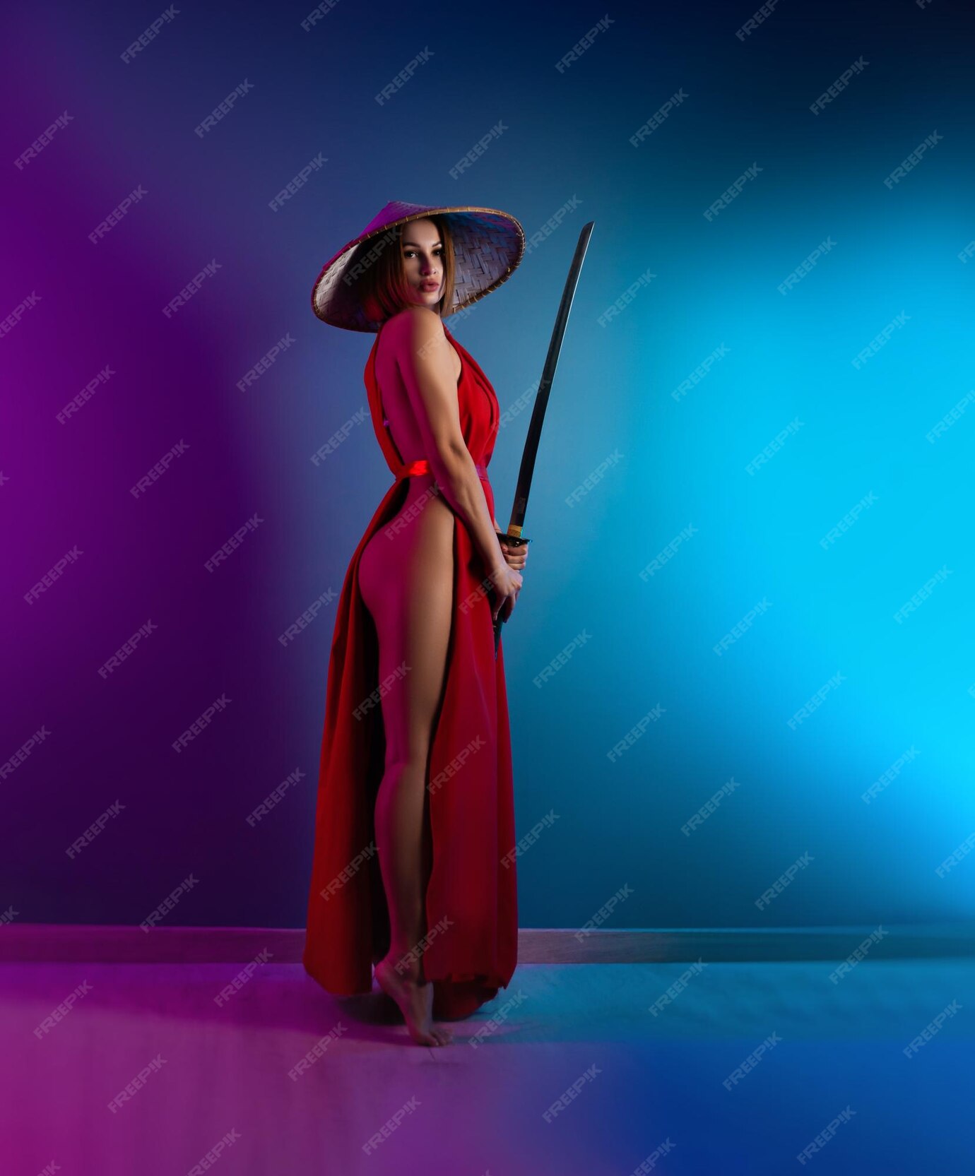 Premium Photo Sexy Girl In A Red Cape And An Asian Hat With A Katana In Her Hand In Neon