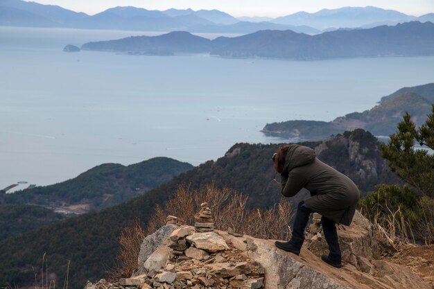 Premium Photo Side View Of Mature Woman Photographing Sea While