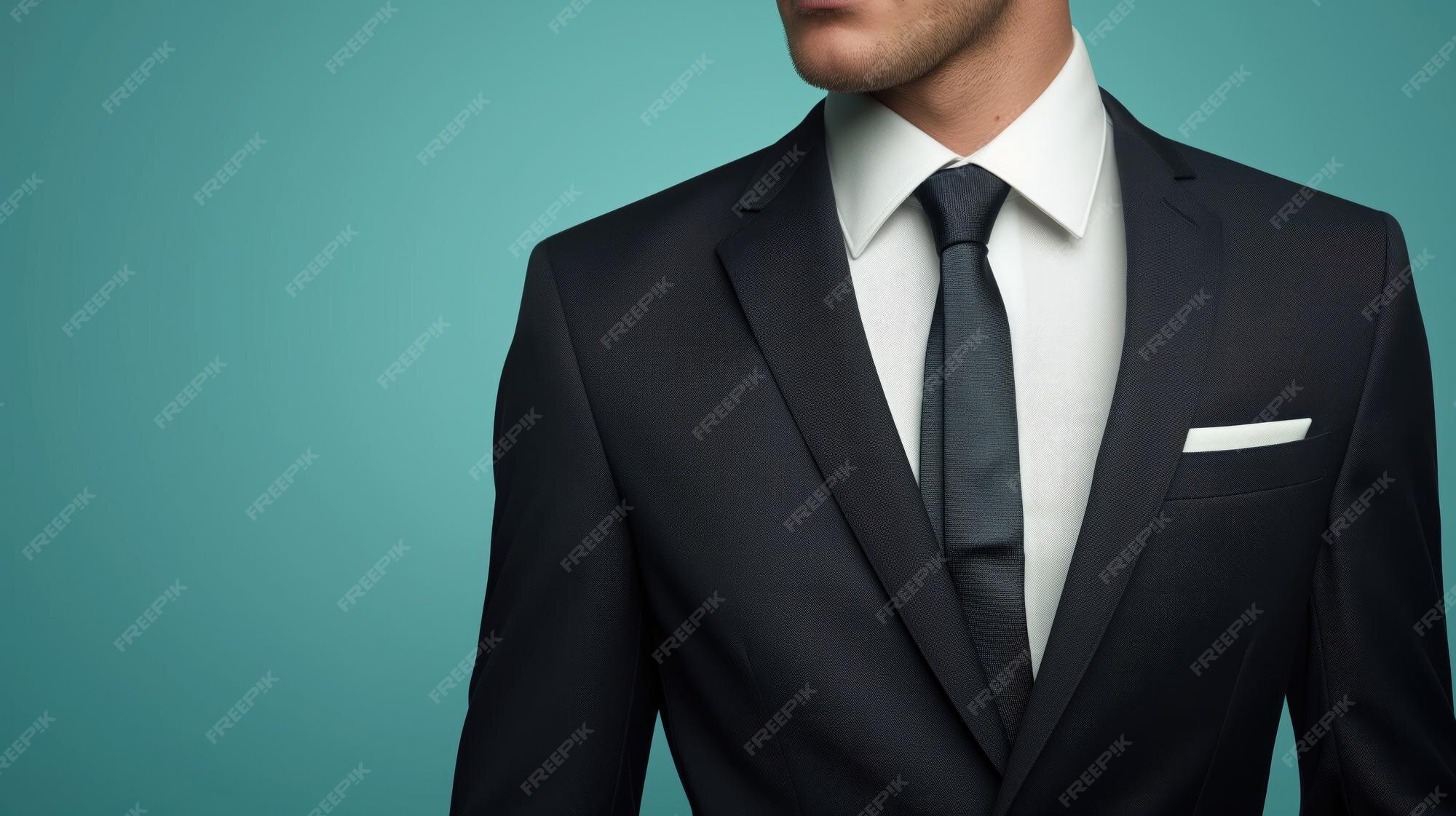 Premium Photo | Smartly dressed man in a suit and tie on teal background Premium Photo | Smartly dressed man in a suit and tie on teal background