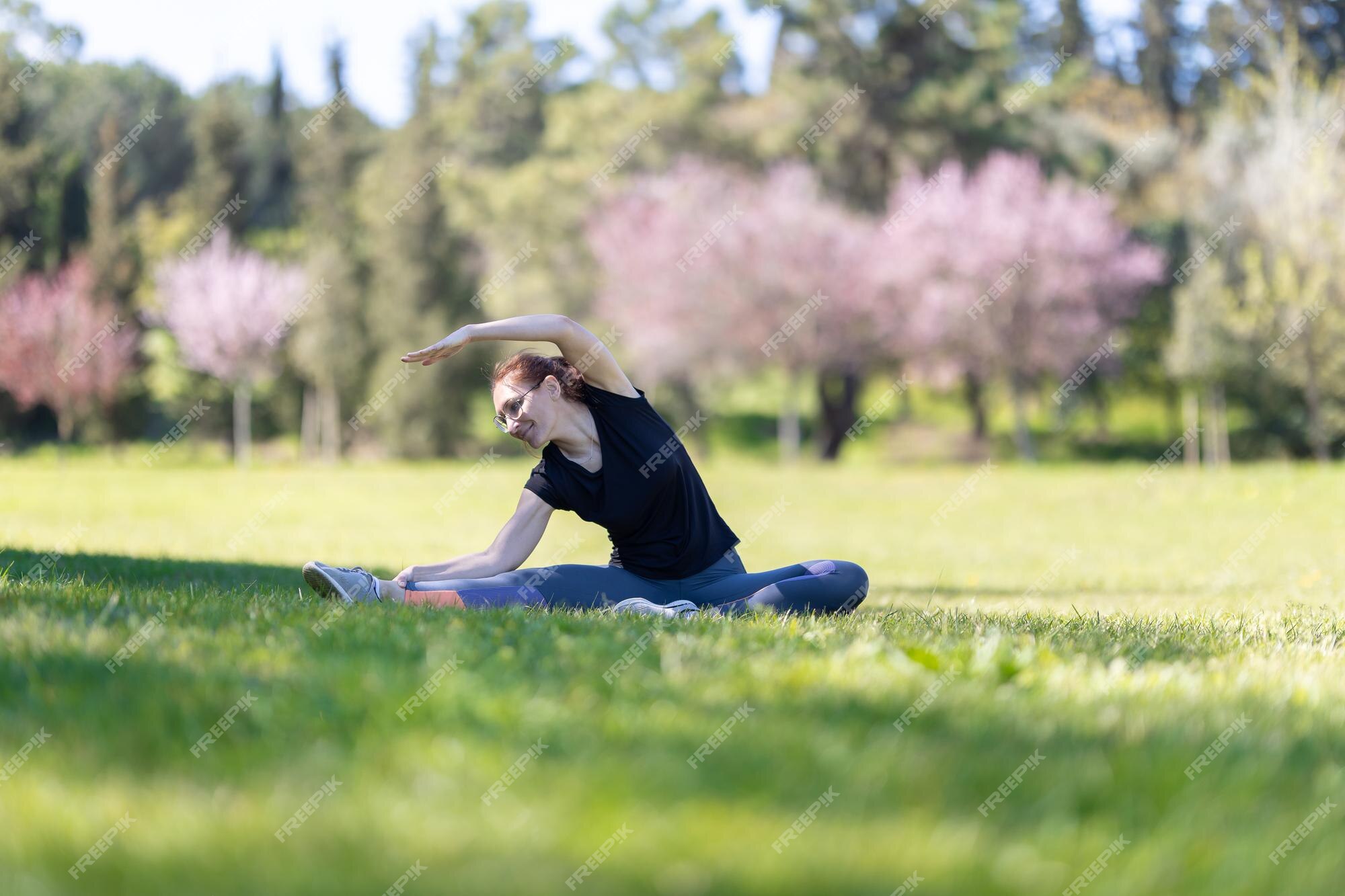 Premium Photo Smiling Adult Woman Sitting In Lotus Position And