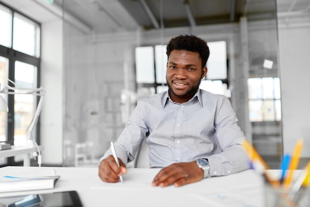 Premium Photo | Smiling african american businessman at office Premium Photo | Smiling african american businessman at office