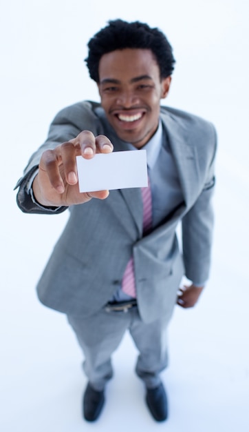 Premium Photo | Smiling afro-american businessman holding a business card Premium Photo | Smiling afro-american businessman holding a business card