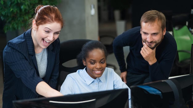 Premium Photo | Smiling business colleagues working at office Premium Photo | Smiling business colleagues working at office