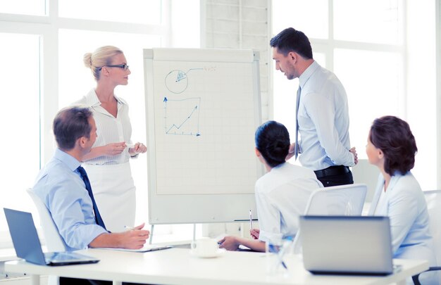 Premium Photo | Smiling business team discussing something in office Premium Photo | Smiling business team discussing something in office