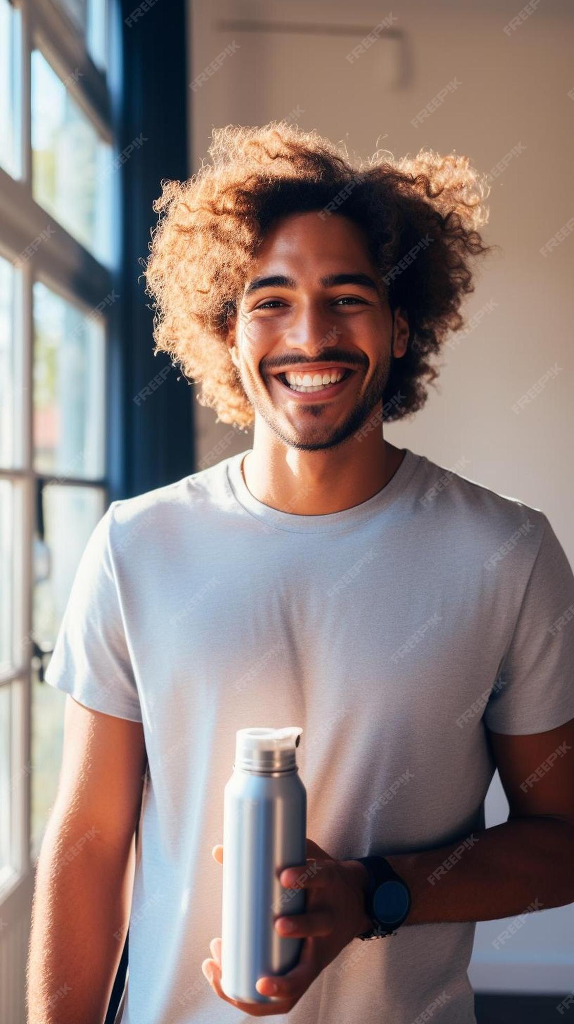 Premium Ai Image A Smiling Man Holding A Can Of Soda