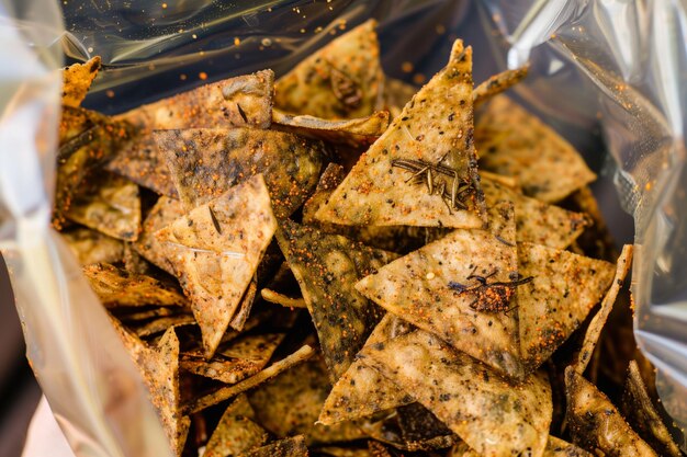 Snacking On A Bag Of Seasoned Beetle Chips Premium Ai Generated Image