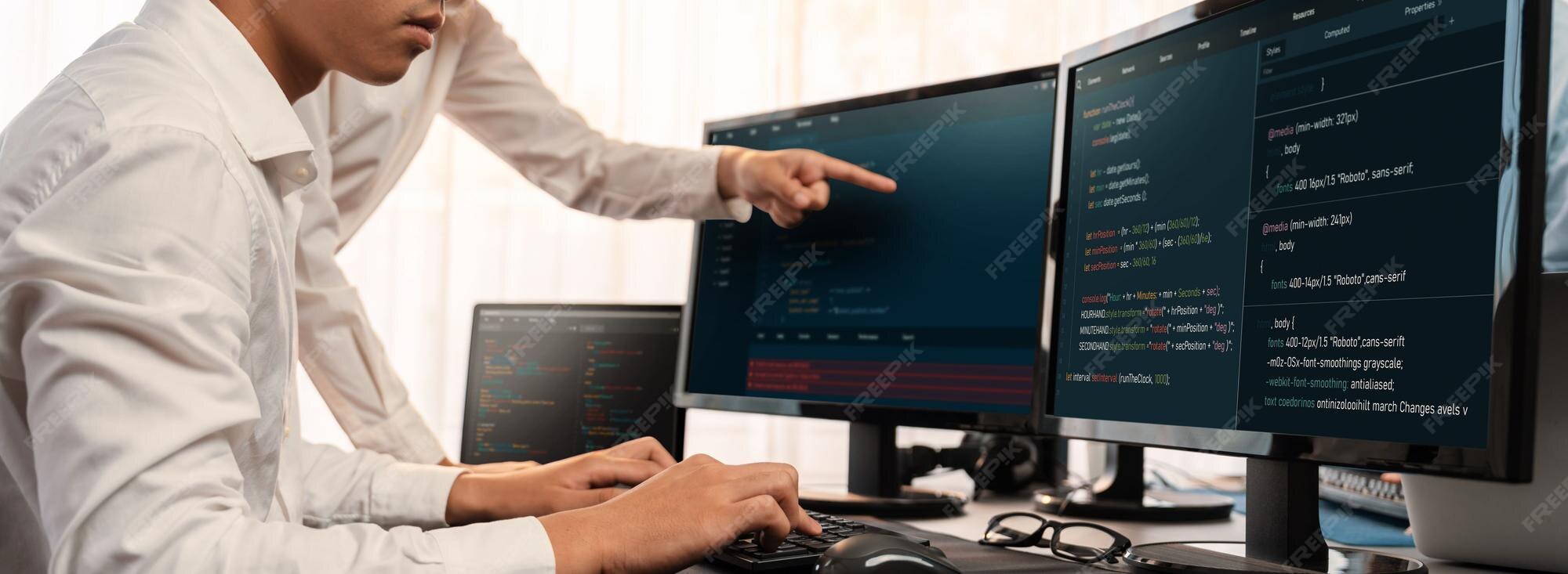 Premium Photo | Software development team working together in office coding script display on ...