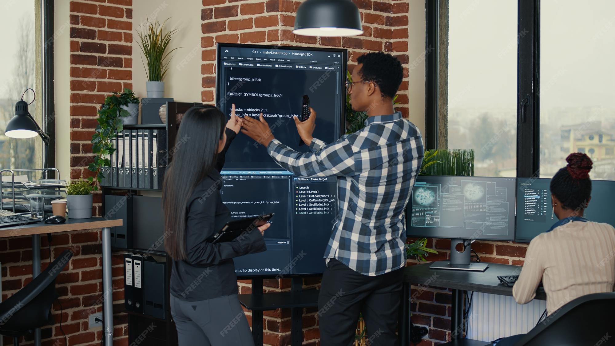 Premium Photo | Software engineers analyzing code on wall screen tv comparing errors using ...
