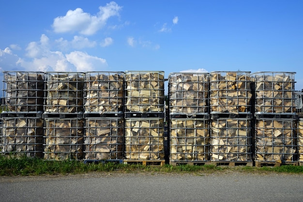 Premium Photo | Stack of metallic structure on field against building Premium Photo | Stack of metallic structure on field against building