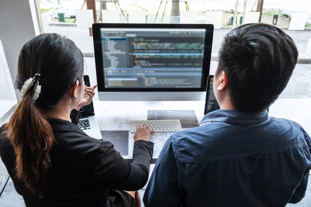 Premium Photo | Programmers working on a project in software development