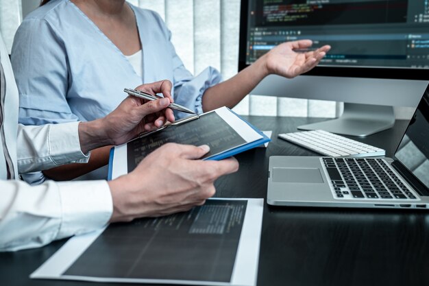 Premium Photo | Professional team of programmer working on project in software development ...