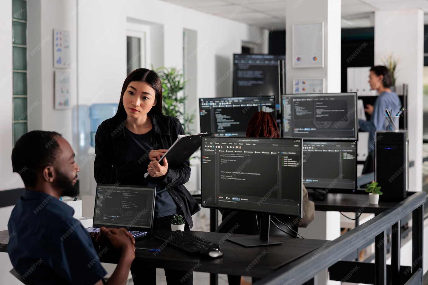 Premium Photo | Team of system engineers working on software development with source code ...