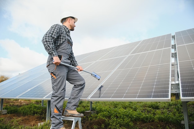 Premium Photo | Technician operating and cleaning solar panels at ... Premium Photo | Technician operating and cleaning solar panels at ...