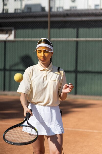Premium Photo Tennis Play Young Girl Kicks Ball On Racquet Sports Woman Using Racket To Juggle