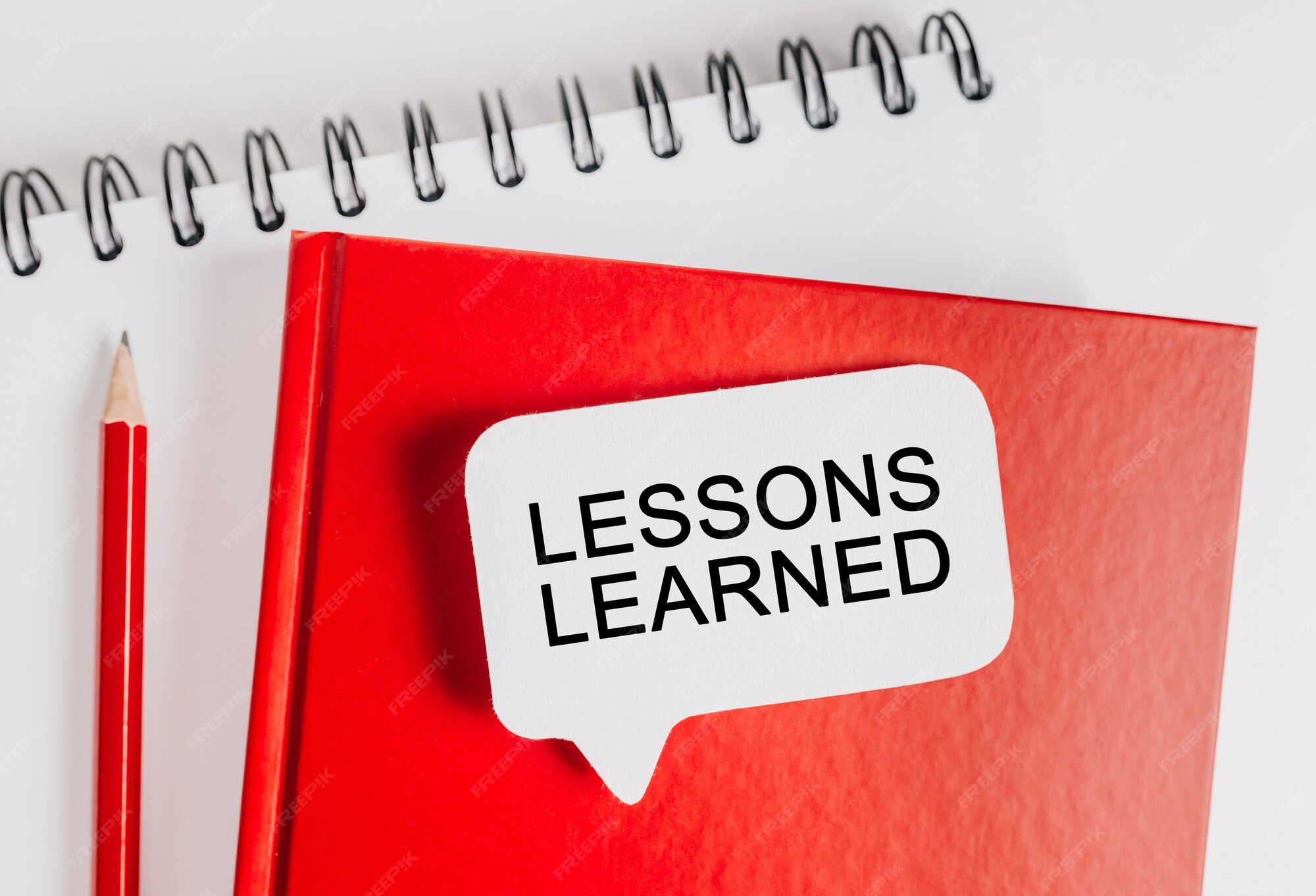 Premium Photo | Text lessons learned a white sticker on red notepad ... Premium Photo | Text lessons learned a white sticker on red notepad ...