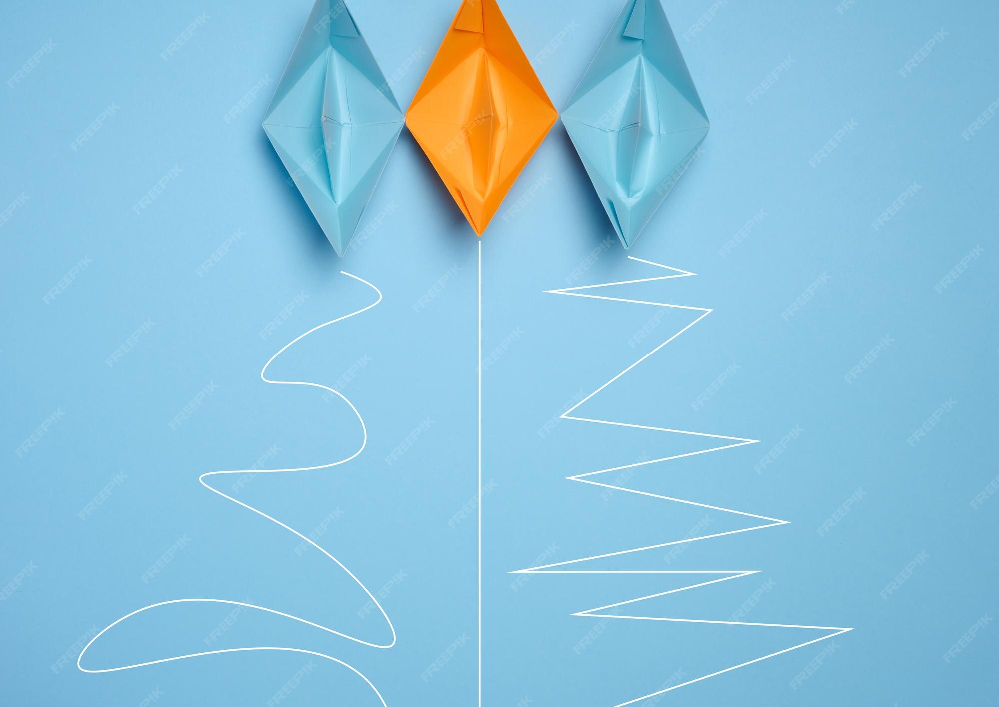 Premium Photo | Three paper boats with different trajectories on a blue ... Premium Photo | Three paper boats with different trajectories on a blue ...
