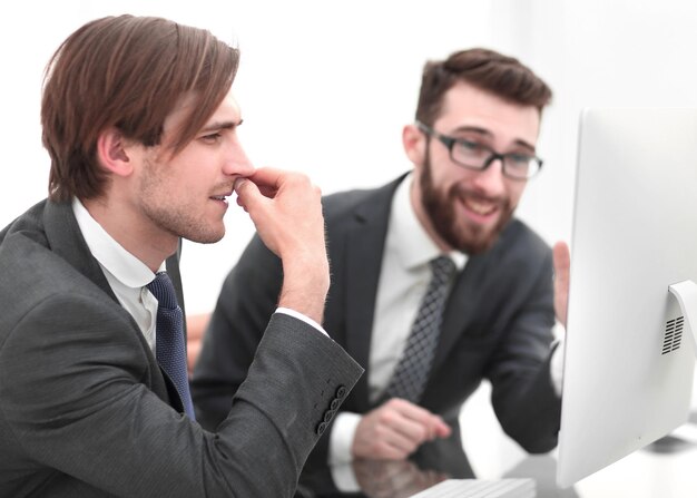 Premium Photo | Two colleagues are talking at the workplace Premium Photo | Two colleagues are talking at the workplace