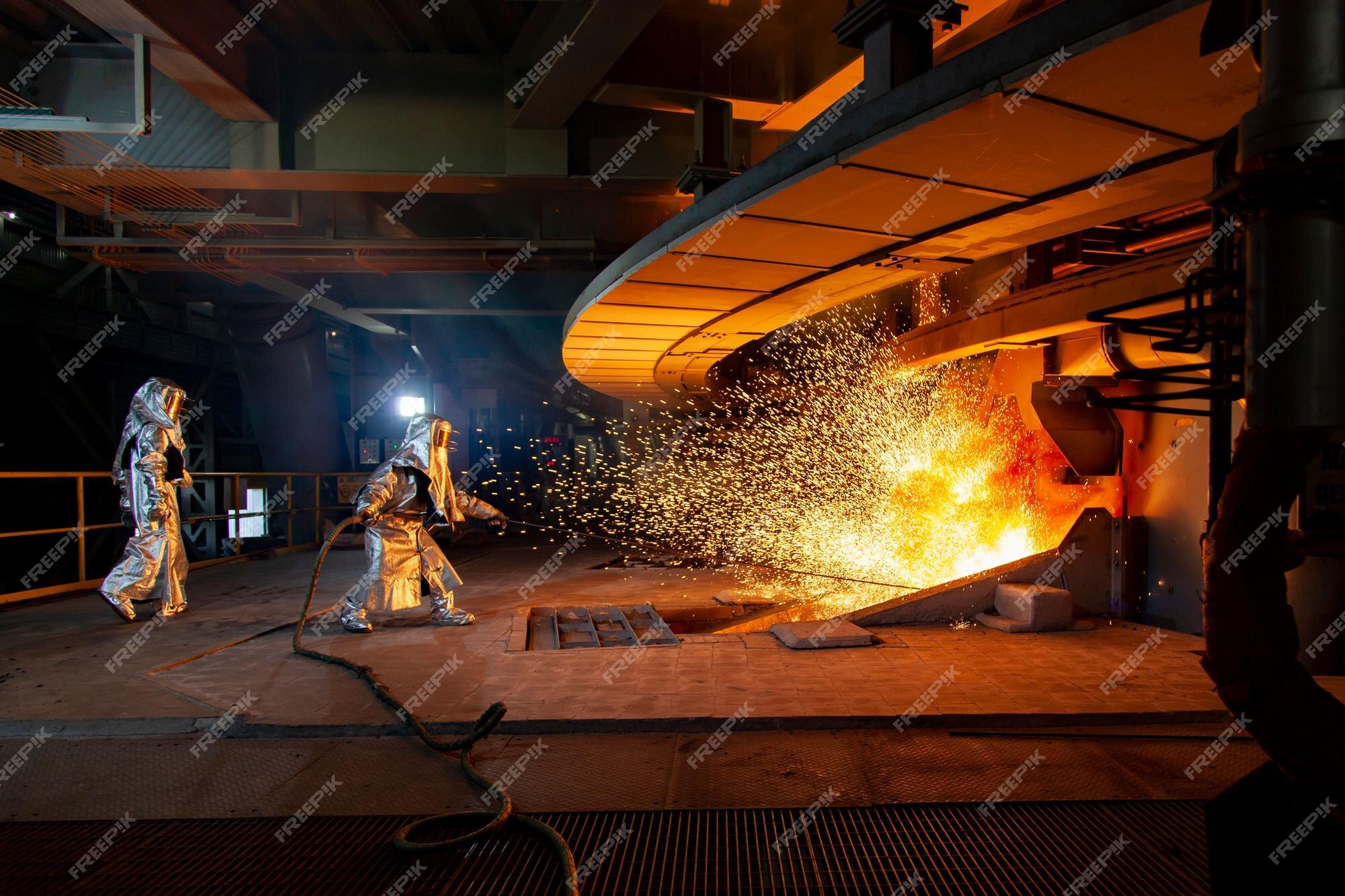Premium Photo | Two factory workers igniting a furnace in an industrial ... Premium Photo | Two factory workers igniting a furnace in an industrial ...