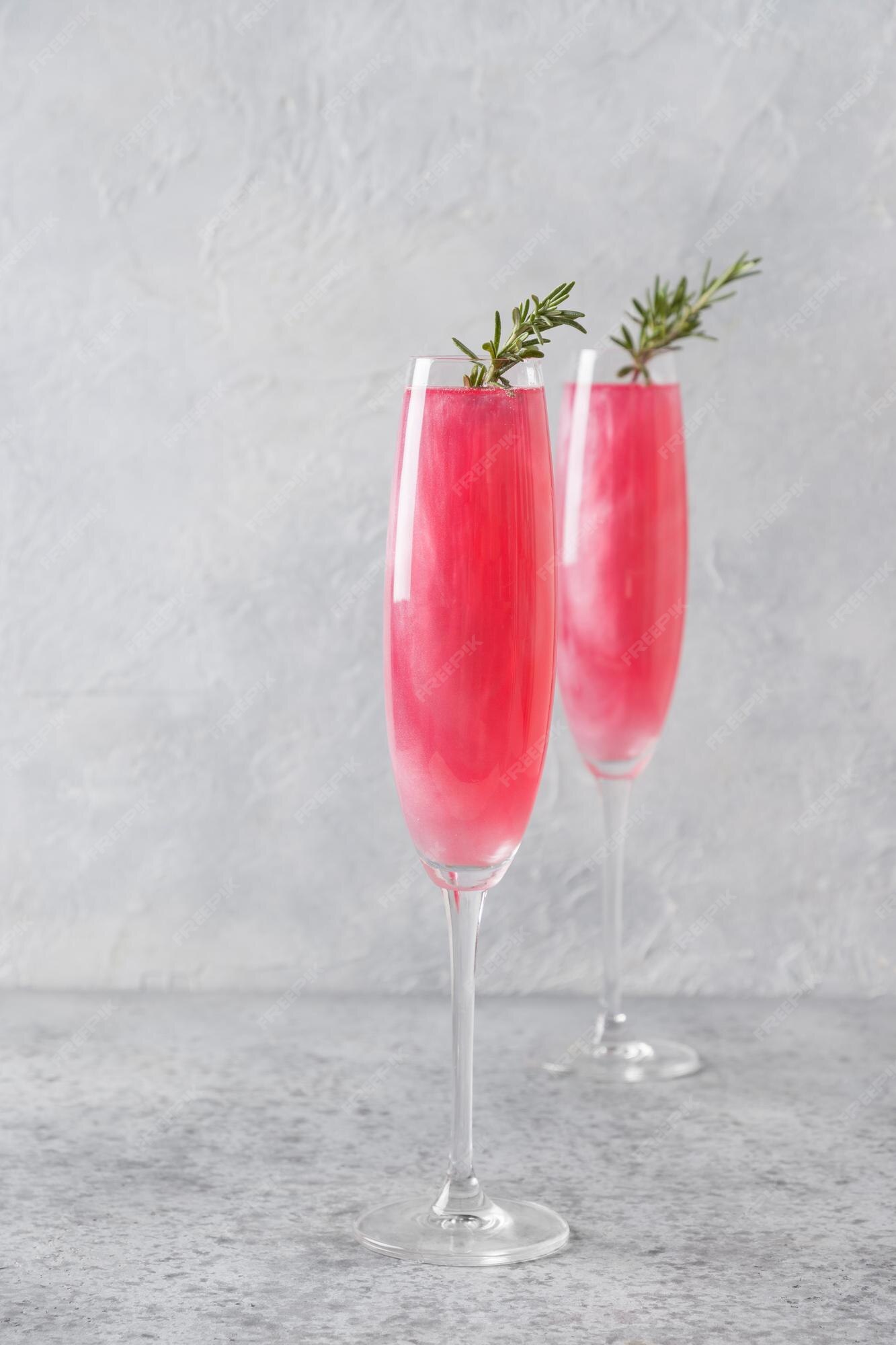Premium Photo Two Glasses Of Sparkling Rose Wine With Shimmer Edible Glitter Garnish Rosemary