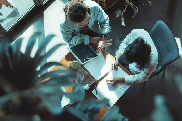 Premium Photo | Two people working on laptops at Premium Photo | Two people working on laptops at