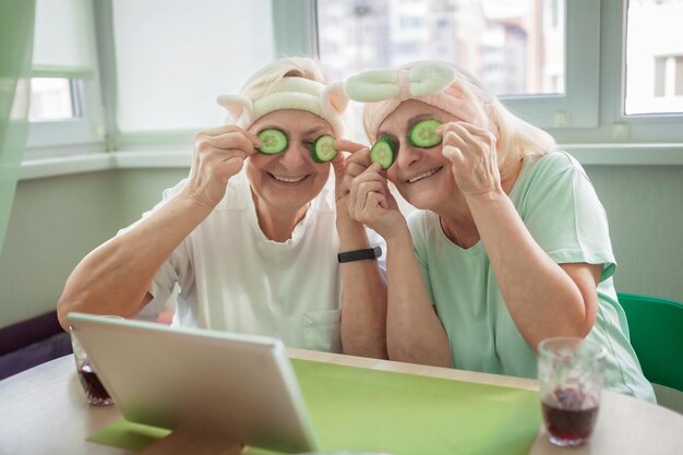 Premium Photo | Two senior women apply facial cosmetic mask have fun at ... Premium Photo | Two senior women apply facial cosmetic mask have fun at ...